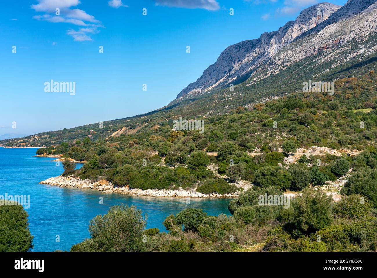 Coastal landscape of wild beaches, trees and mountains in Greece Stock ...