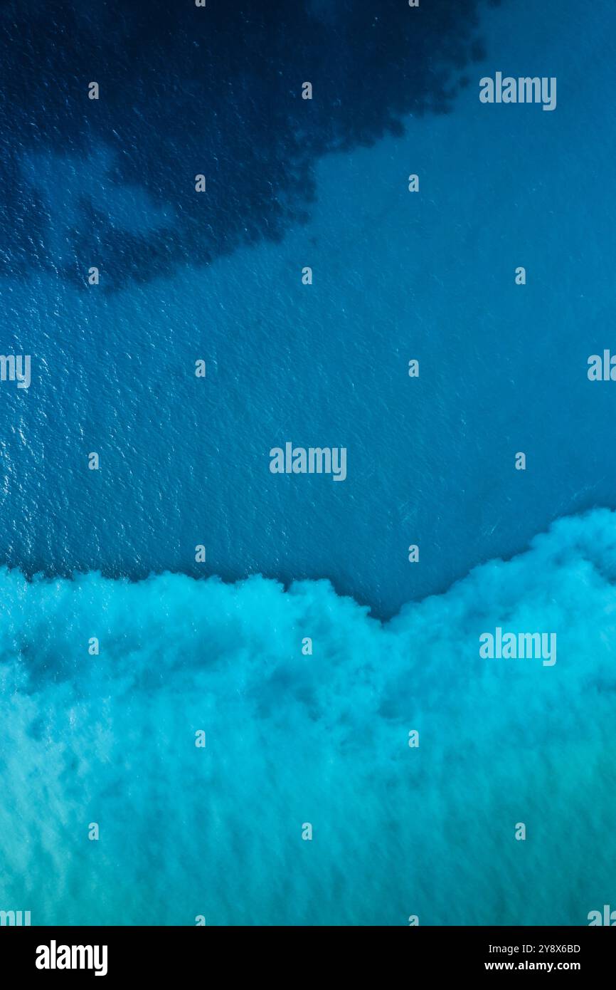 Drone top view of sea division between turquoise water and deep blue ...