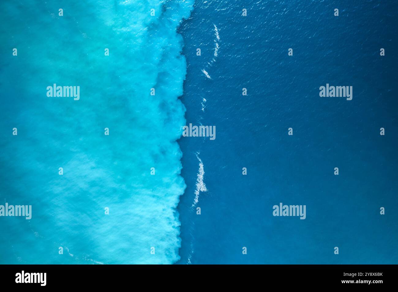 Drone top view of sea division between turquoise water and deep blue ...