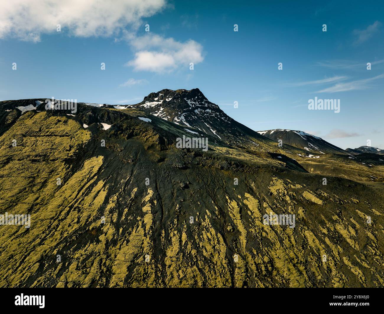 Volcanic terrain with mountains covered in snow Stock Photo - Alamy