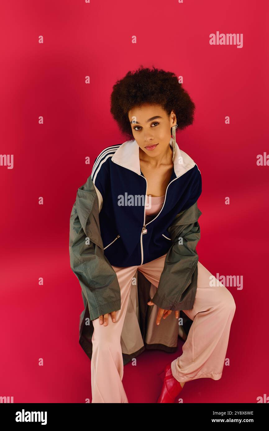 An emotional young woman dressed in stylish clothing conveys her ...