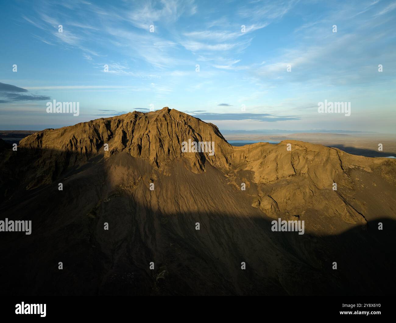 Rugged mountain range in sunlight of evening Stock Photo - Alamy