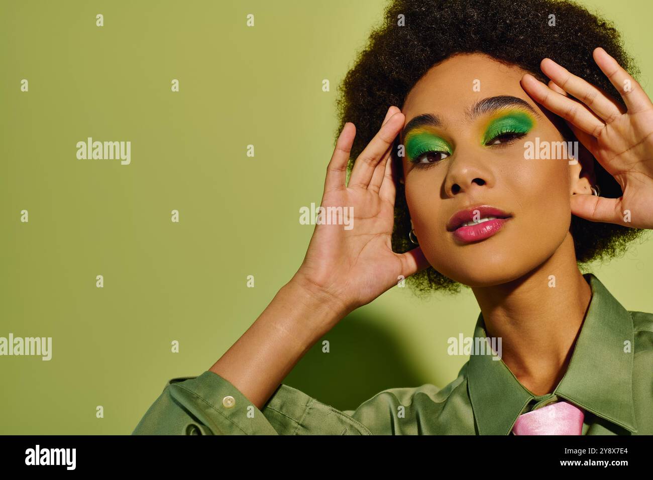 A young woman displays heartfelt emotions, adorned with bold green ...