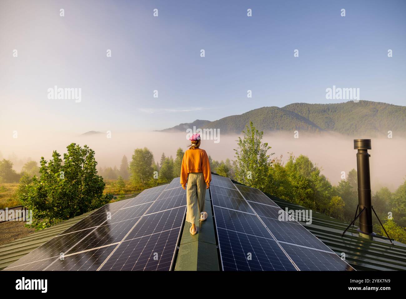 Walking on Solar Panels: Morning Mist and Mountain View Stock Photo - Alamy