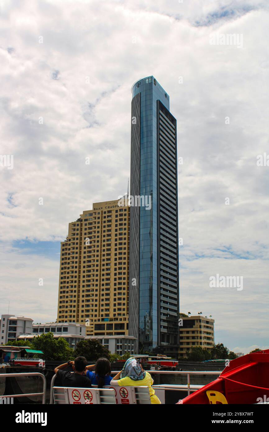 Bangkok. A modern skyscraper in the Thai capital seen from the Chao ...