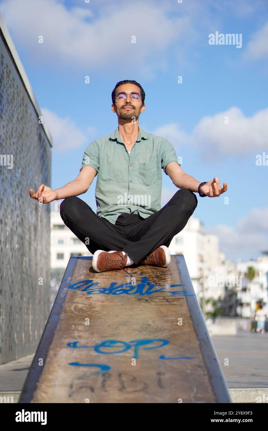 zen arab man pacticing yoga on the nevada skate park at Casablanca in ...