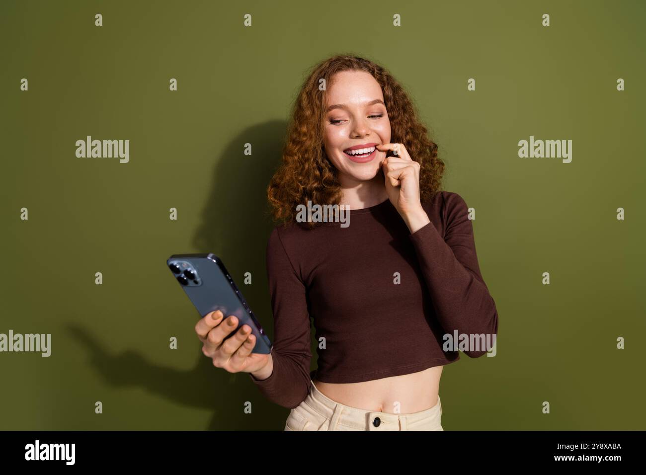 Photo of tricky cunning teen lady dressed brown clothes typing messages ...