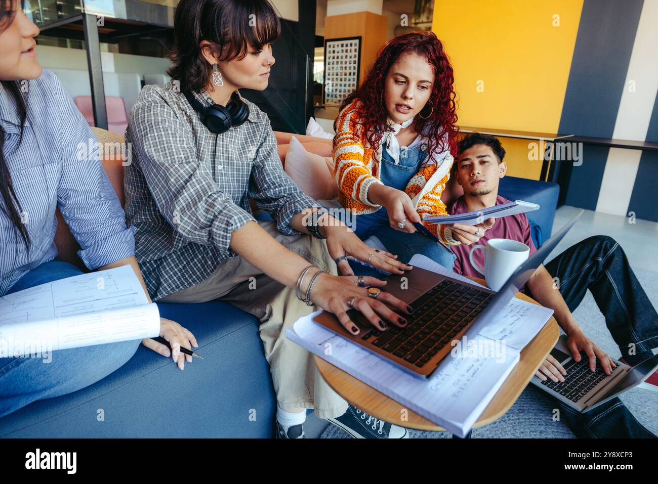 Diverse high school students collaborate on a project, fostering learning, communication, and ...