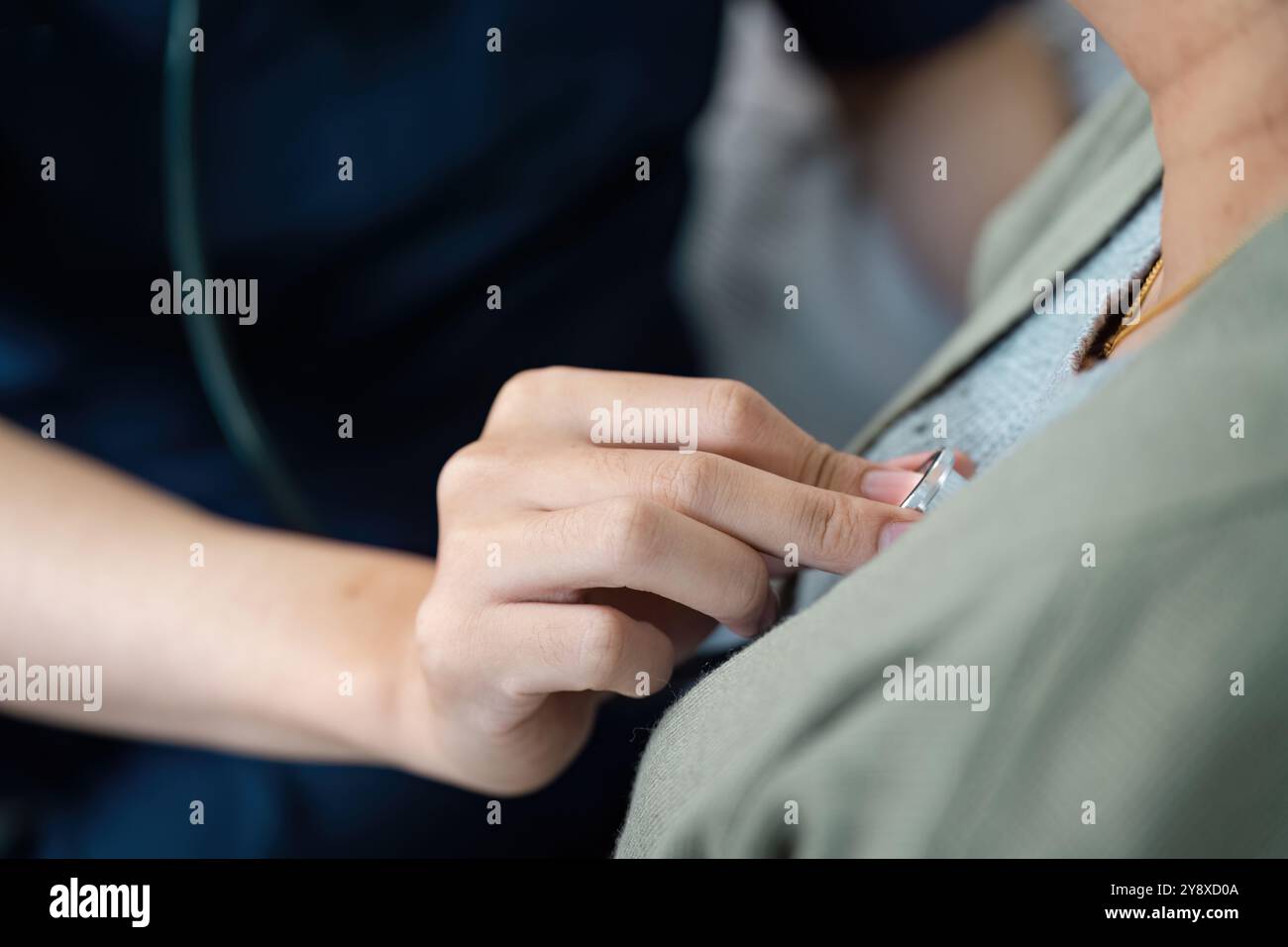 Healthcare Professional Using Stethoscope for Patient Examination in a ...