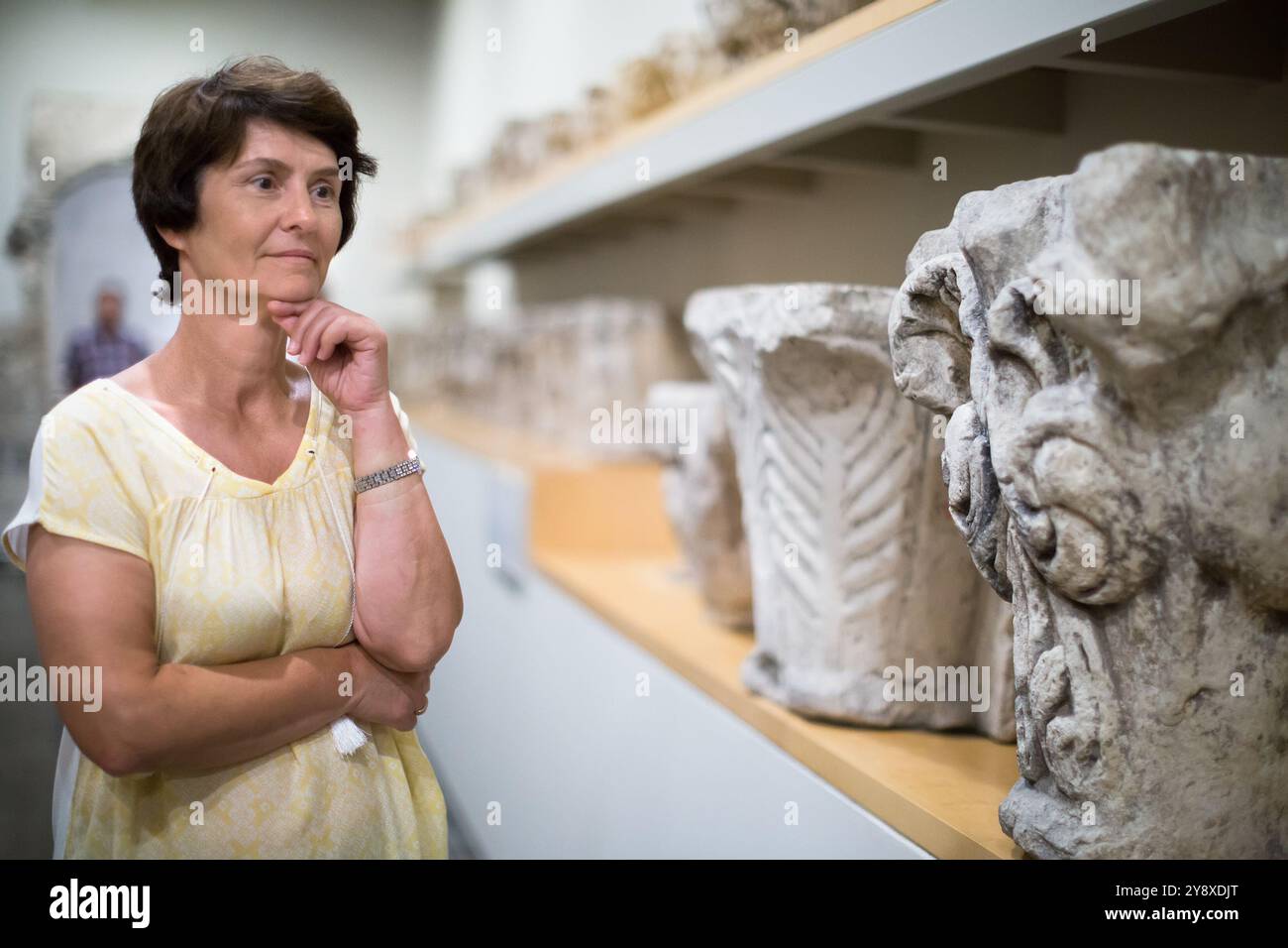 Woman examines the exhibit in historical museum Stock Photo - Alamy