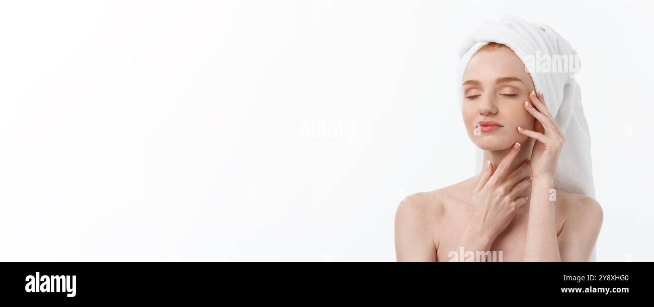 beautiful model applying cosmetic cream treatment on her face on white ...