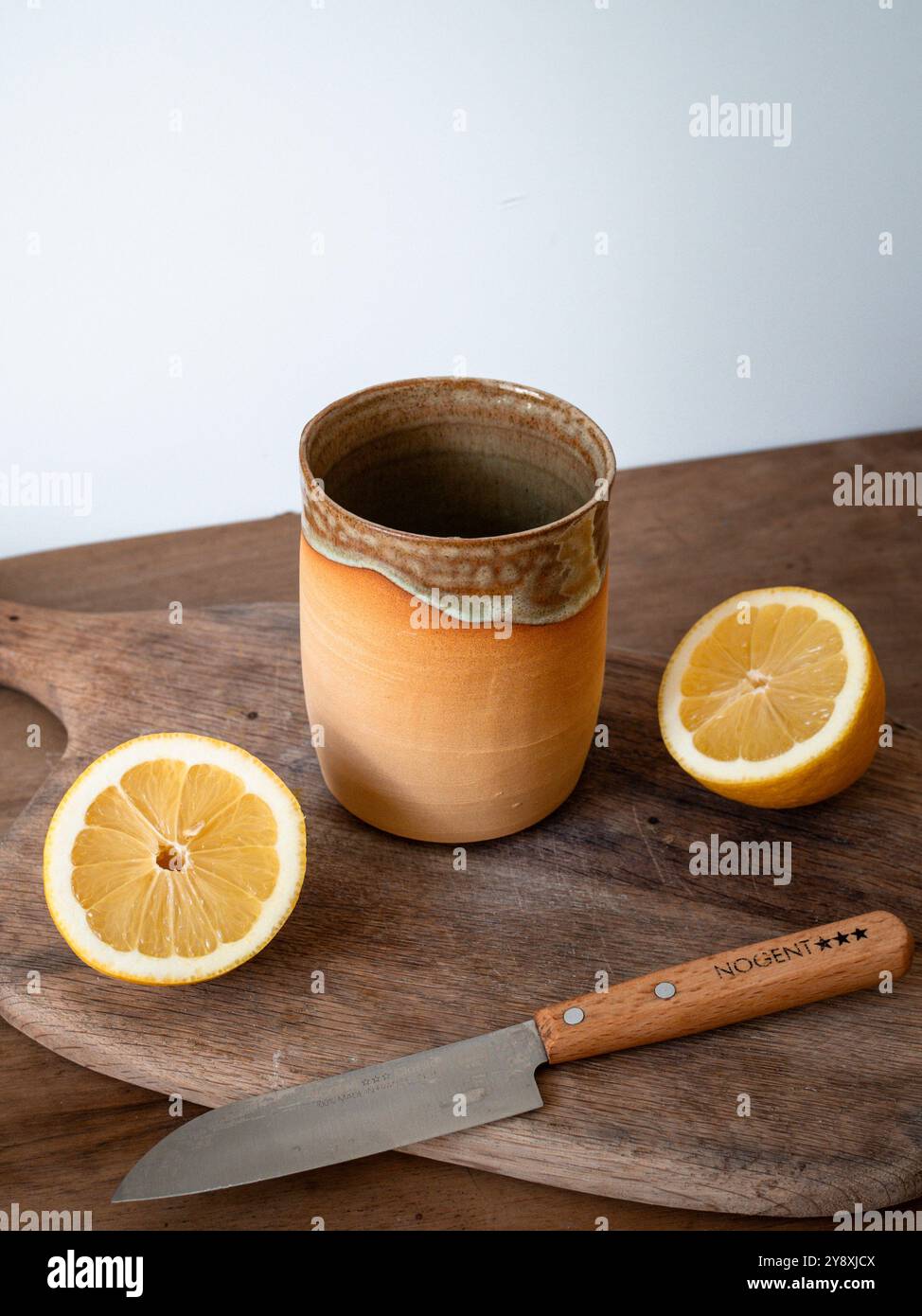 Beautiful artisanal pottery composition, cups and slized lemon with ...