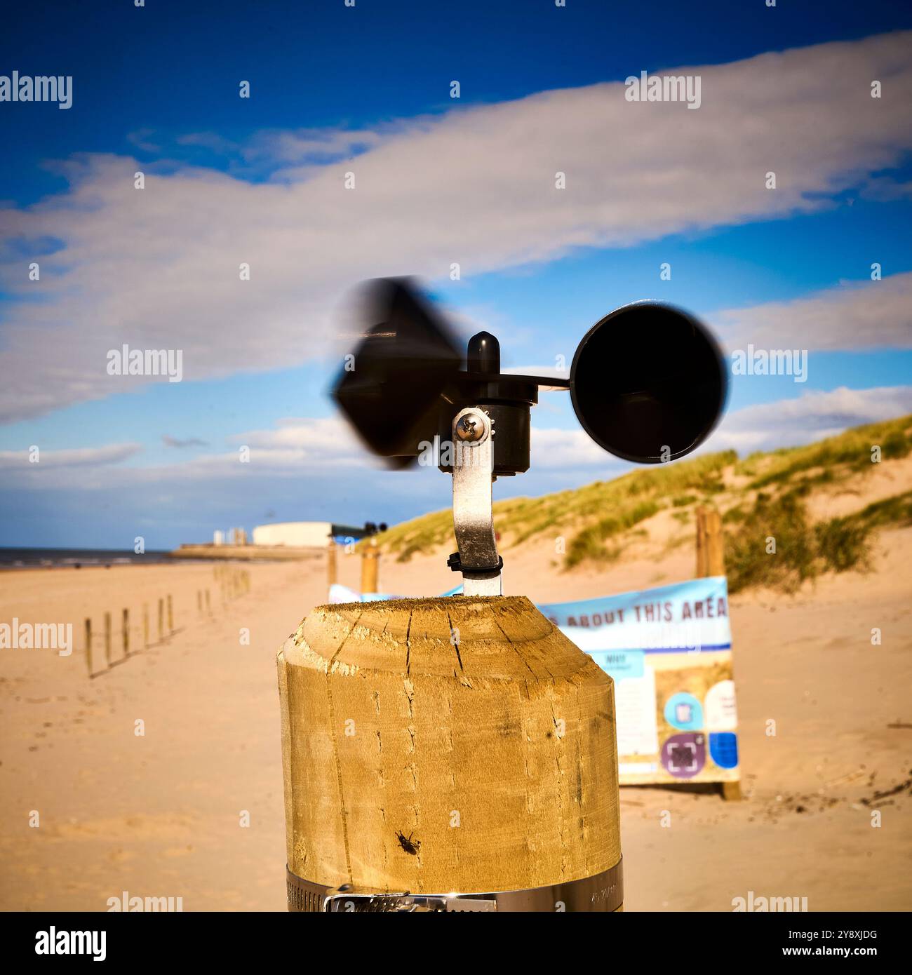 Anemometer on wooden post measuring wind speed on sand dunes and how to ...
