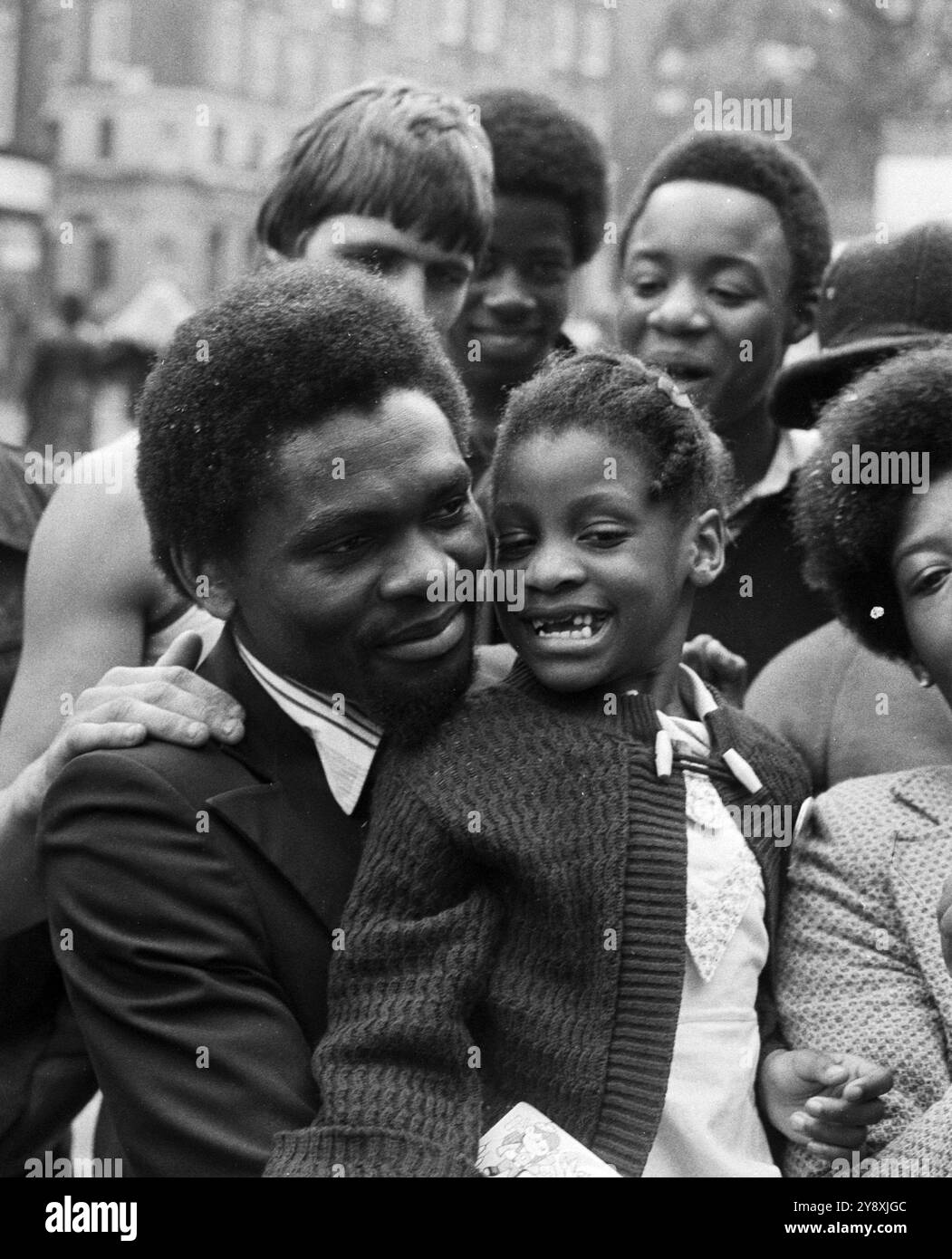 Six-year-old Dawn Lindo, smiling with her father George, 27, after he ...