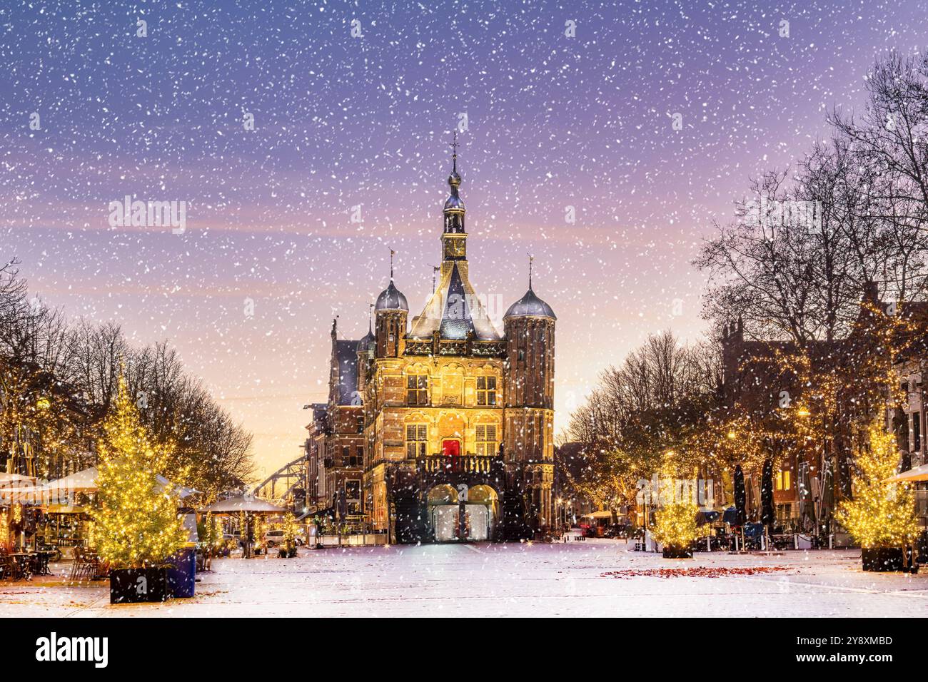 Winter view with snowfall of the central historic square with bars and ...