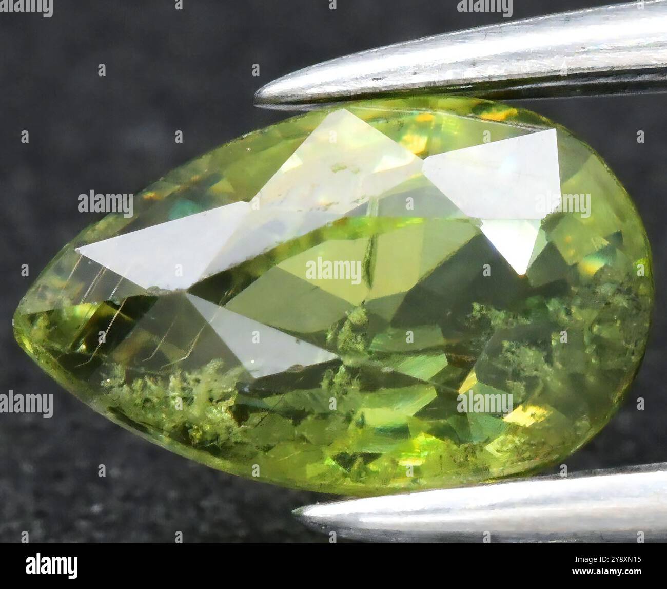 Exquisite Pear-Shaped Peridot Gemstone Illuminated with Vibrant Green ...