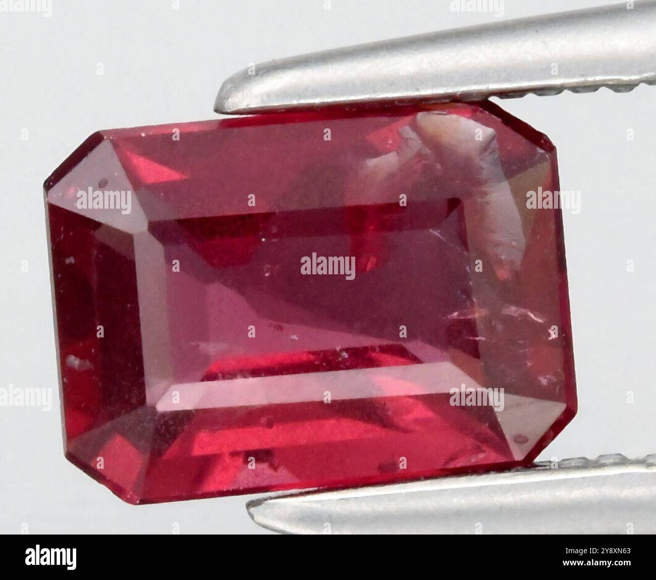 Stunning Deep Red Emerald-Cut Ruby Gemstone Glimmering Under Light ...