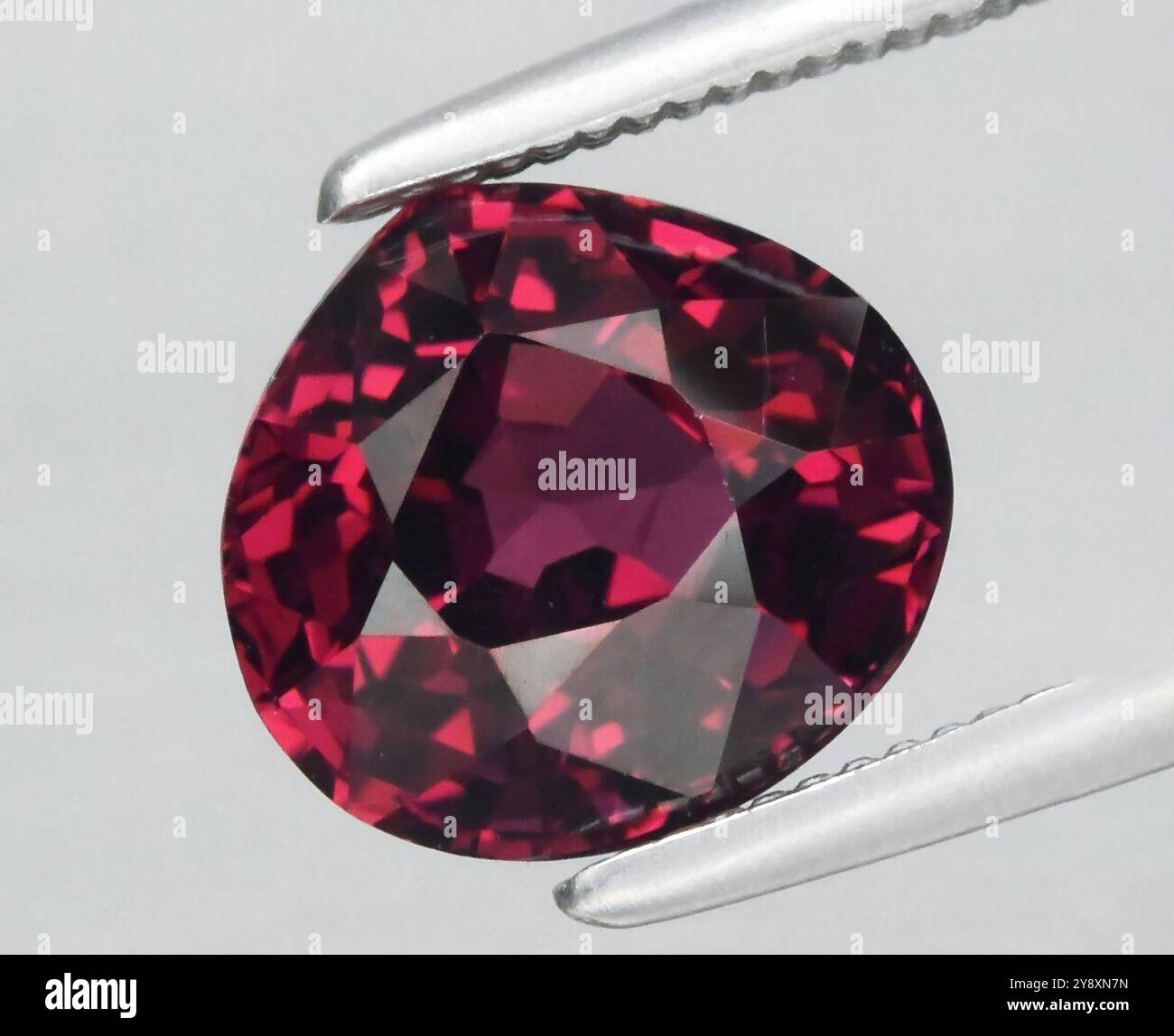 Radiant Deep Red Gemstone Captured in a Gleaming Light Reflection Stock ...