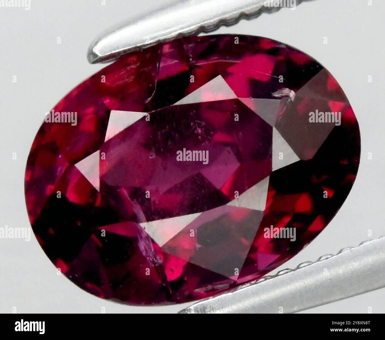 Radiant Deep Red Ruby Gemstone Caught in Glimmering Light Stock Photo ...