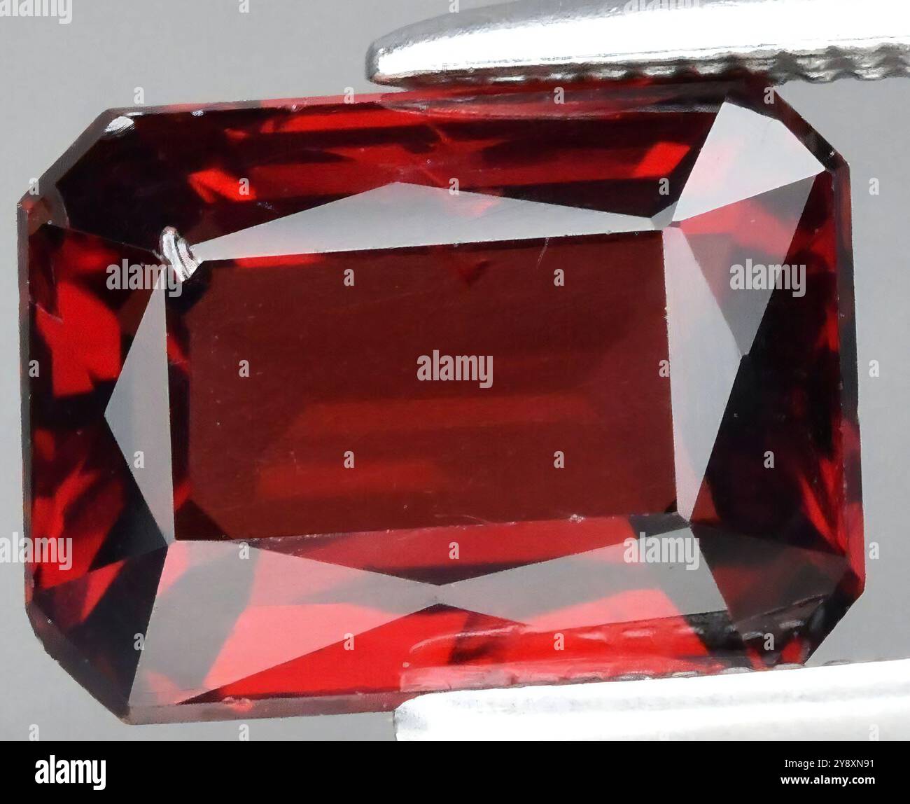 Brilliantly Cut Deep Red Ruby Sparkling Under Light Stock Photo - Alamy