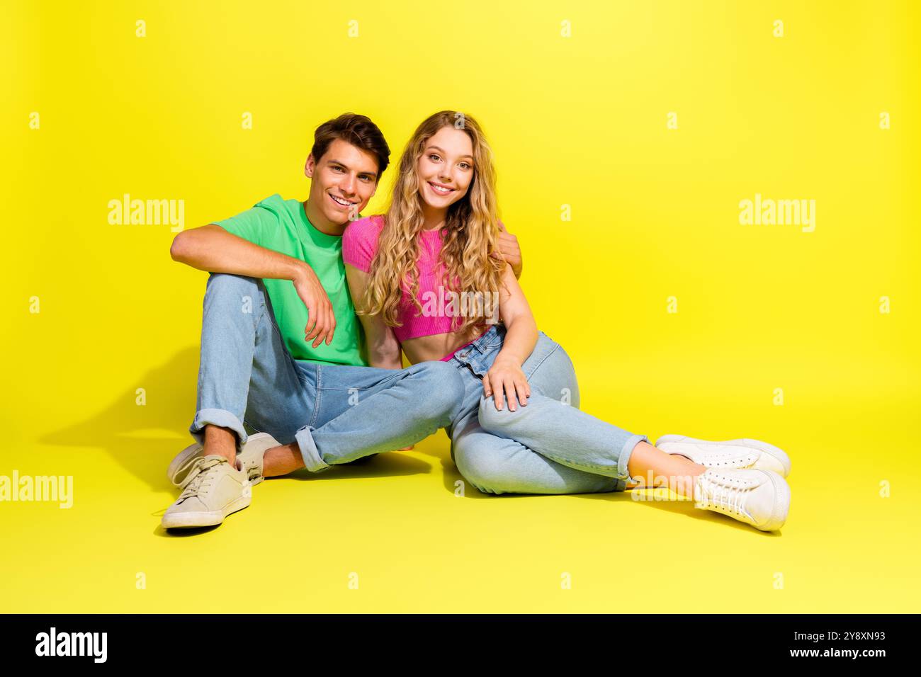 Full size photo of two nice young people sit floor cuddle isolated on ...