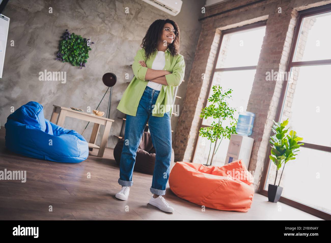 Full body portrait of young corporate lady folded arms think loft ...