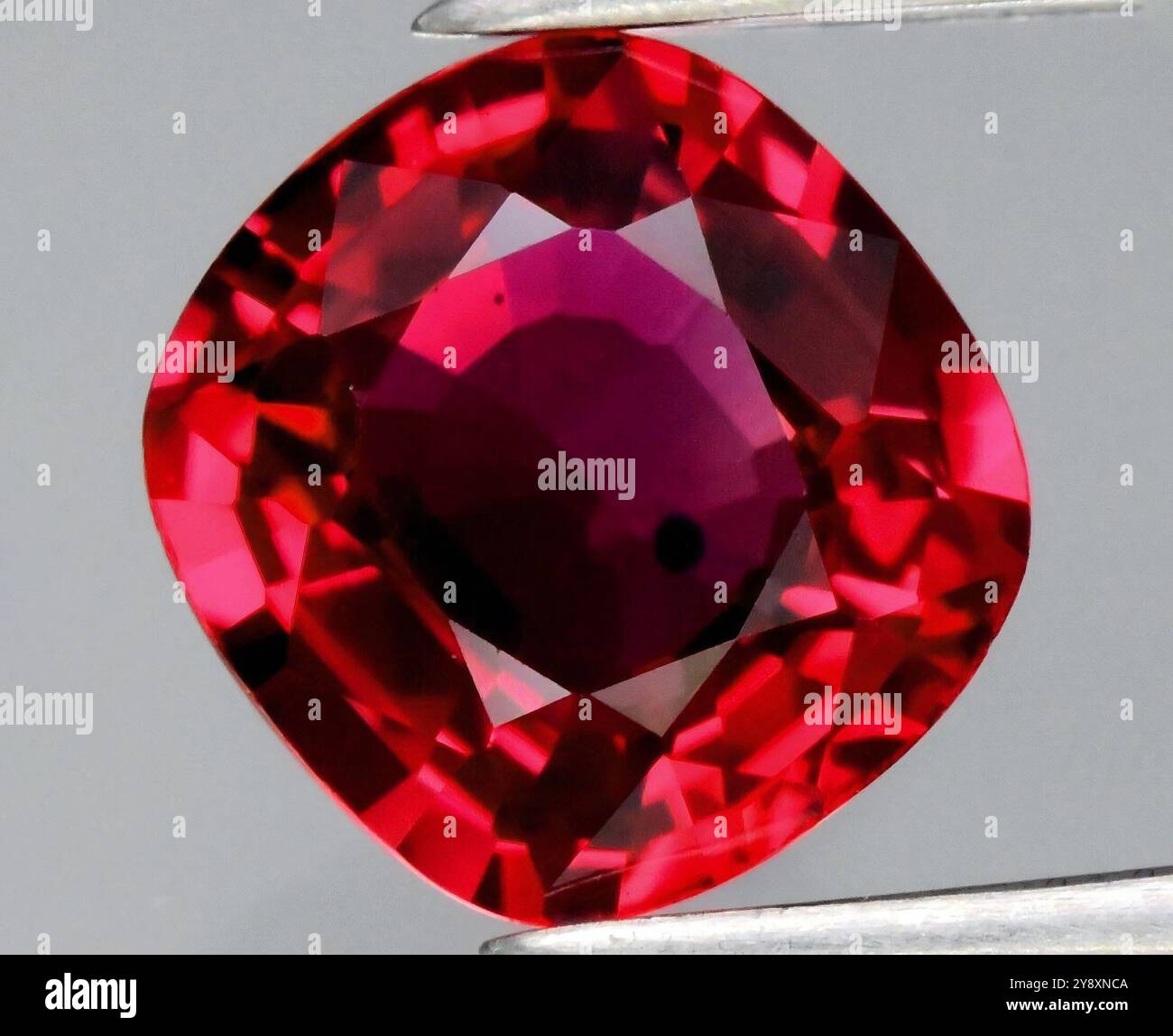 Exquisite Deep Red Cushion-Cut Ruby Gemstone Captured in Radiant Light ...