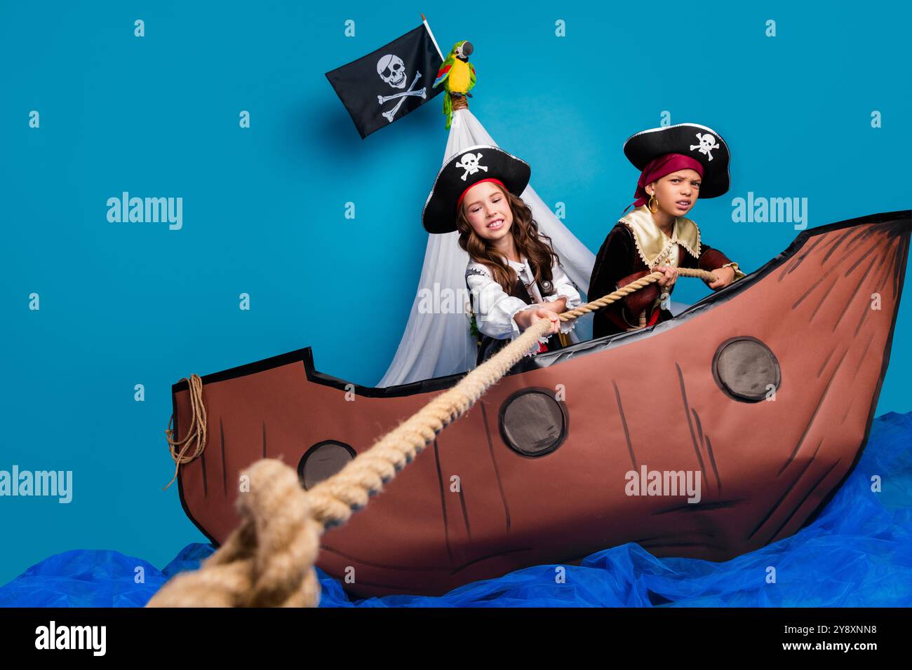 Full body photo of cute little boy girl pulling rope dressed pirates ...