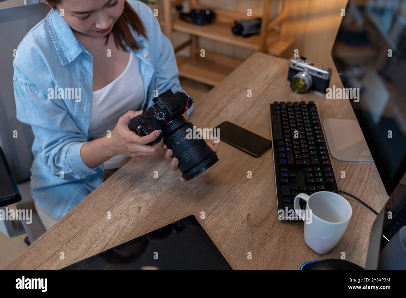 Female photographer editing photos on hi-res stock photography and ...