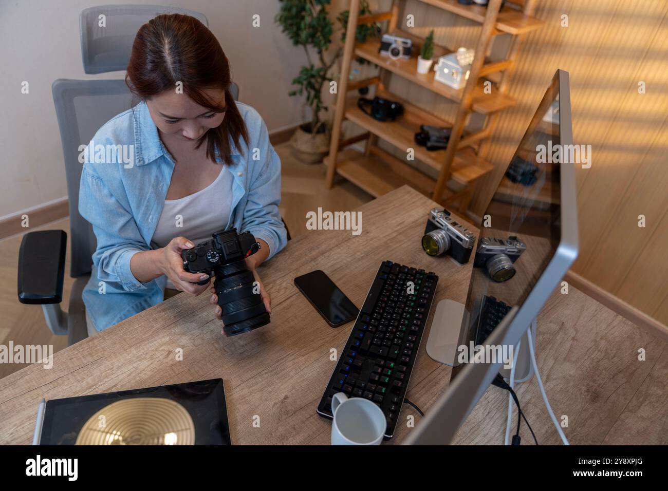 Female photographer editing photos on hi-res stock photography and ...