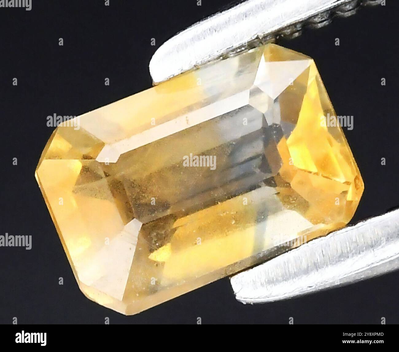 Radiant Golden Gemstone Captured in Natural Light Stock Photo - Alamy