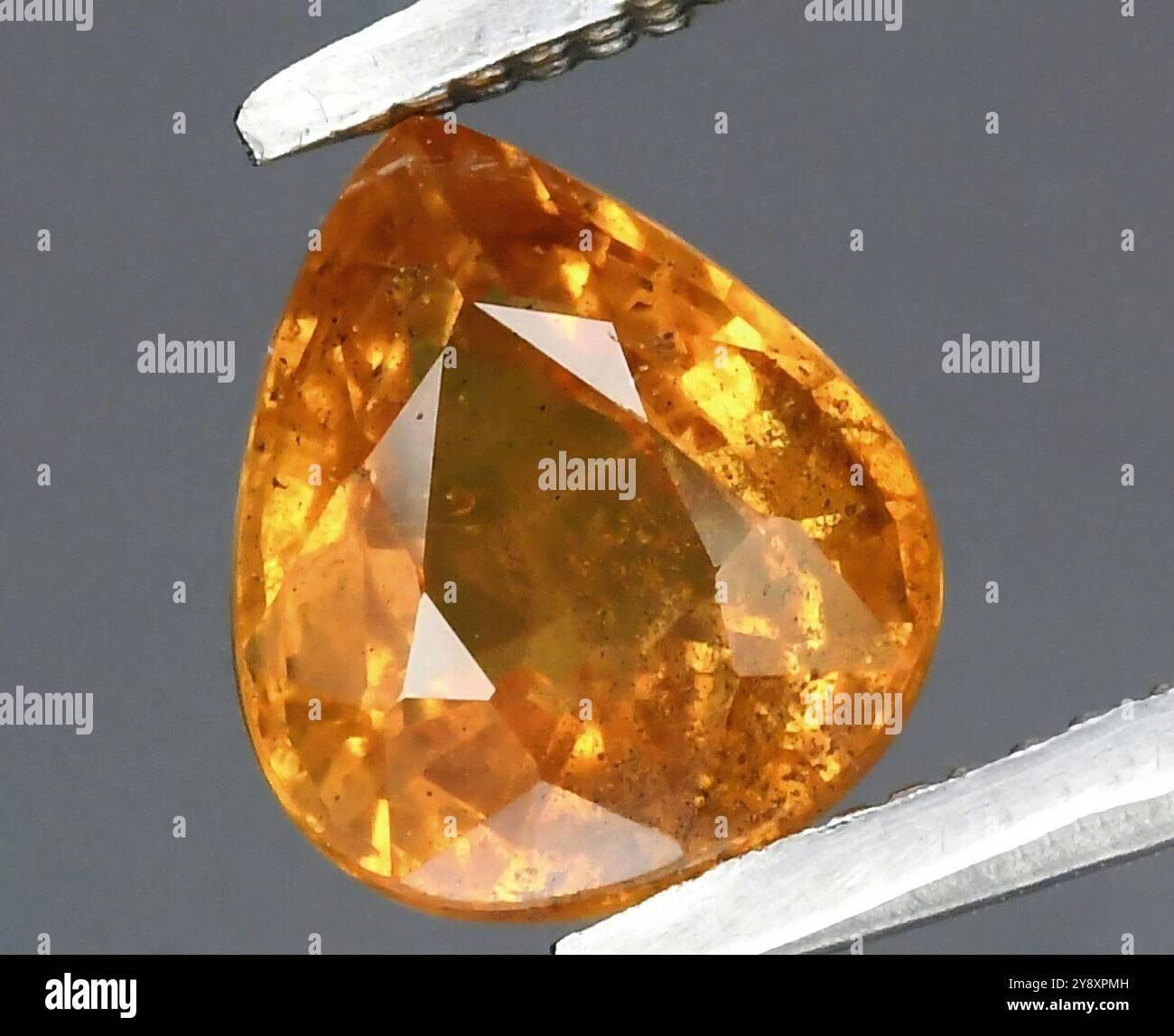 Radiant Teardrop-Shaped Amber Gemstone with Intricate Inclusions Stock Photo - Alamy