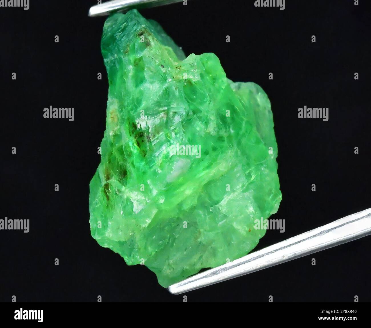 Vibrant Green Gemstone Glimmering Under Light Stock Photo - Alamy