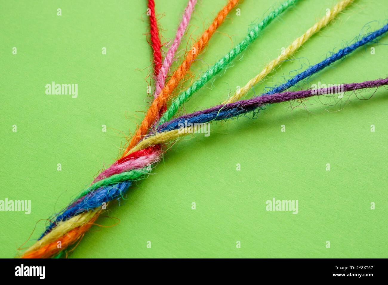 Rope twisted from multicolored threads. Unity and diversity Stock Photo ...