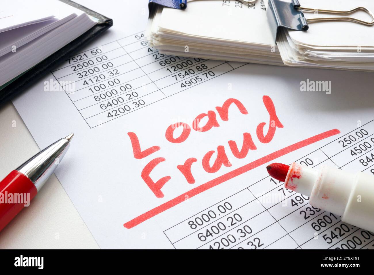 Handwritten note loan fraud on document Stock Photo - Alamy