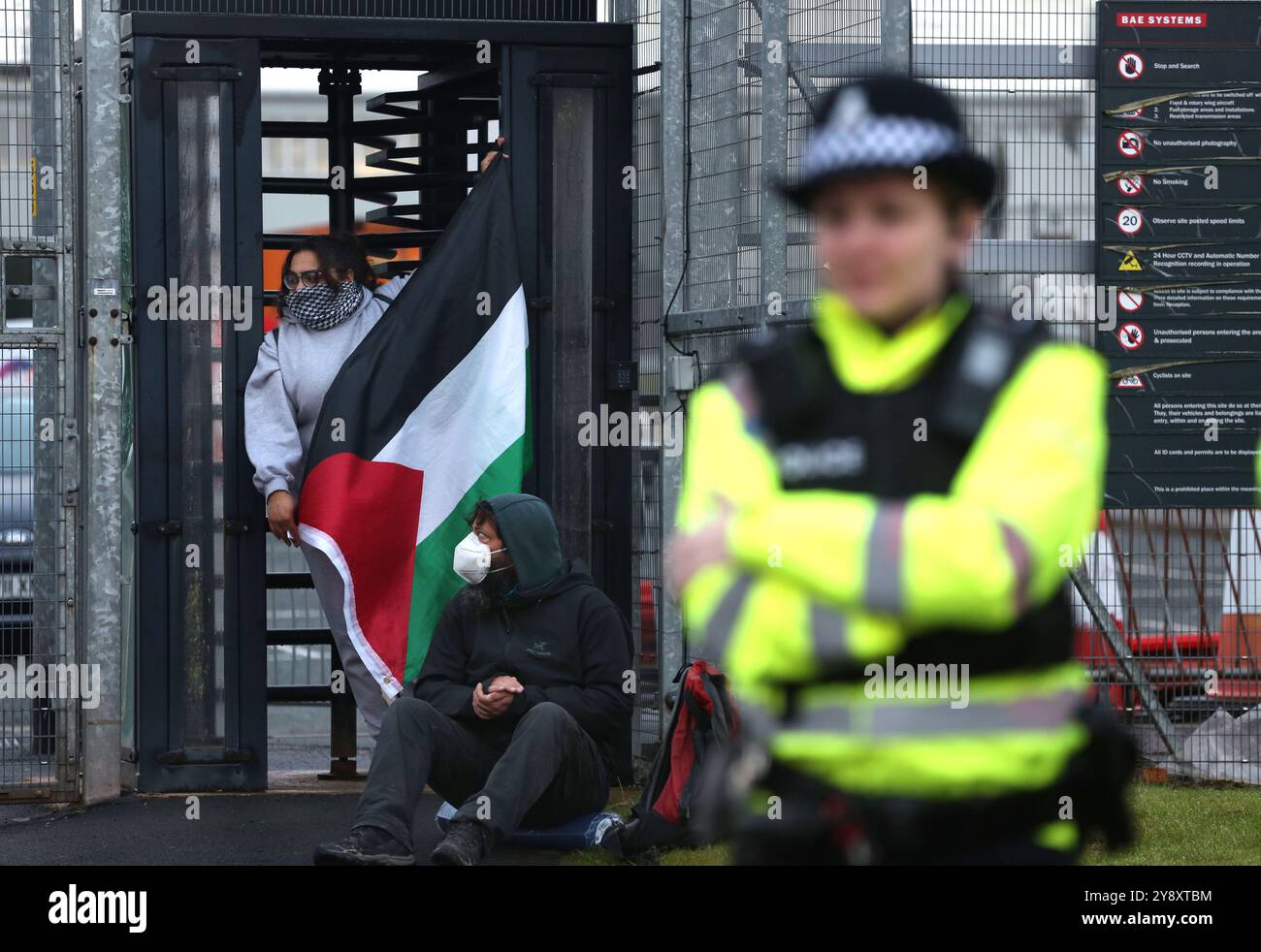 October 7, 2024, Blackburn, England, UK: Protesters block the turnstile ...