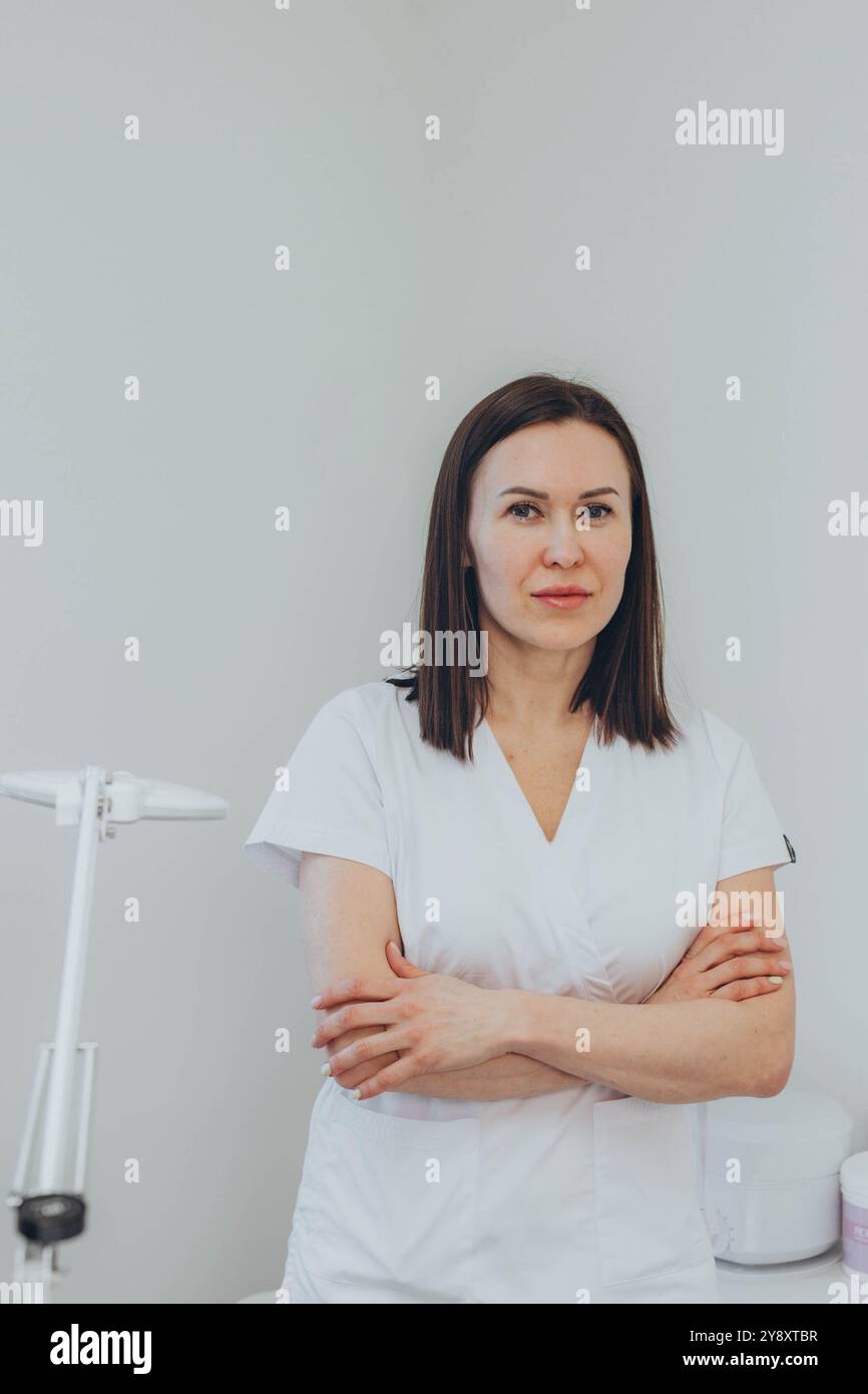 A woman doctor is a cosmetologist in her beauty salon. High quality ...