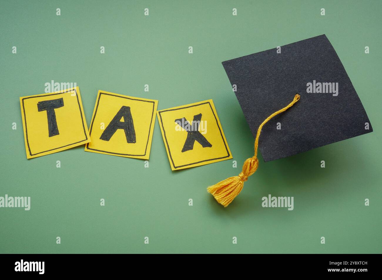Graduation cap with label tax Stock Photo - Alamy