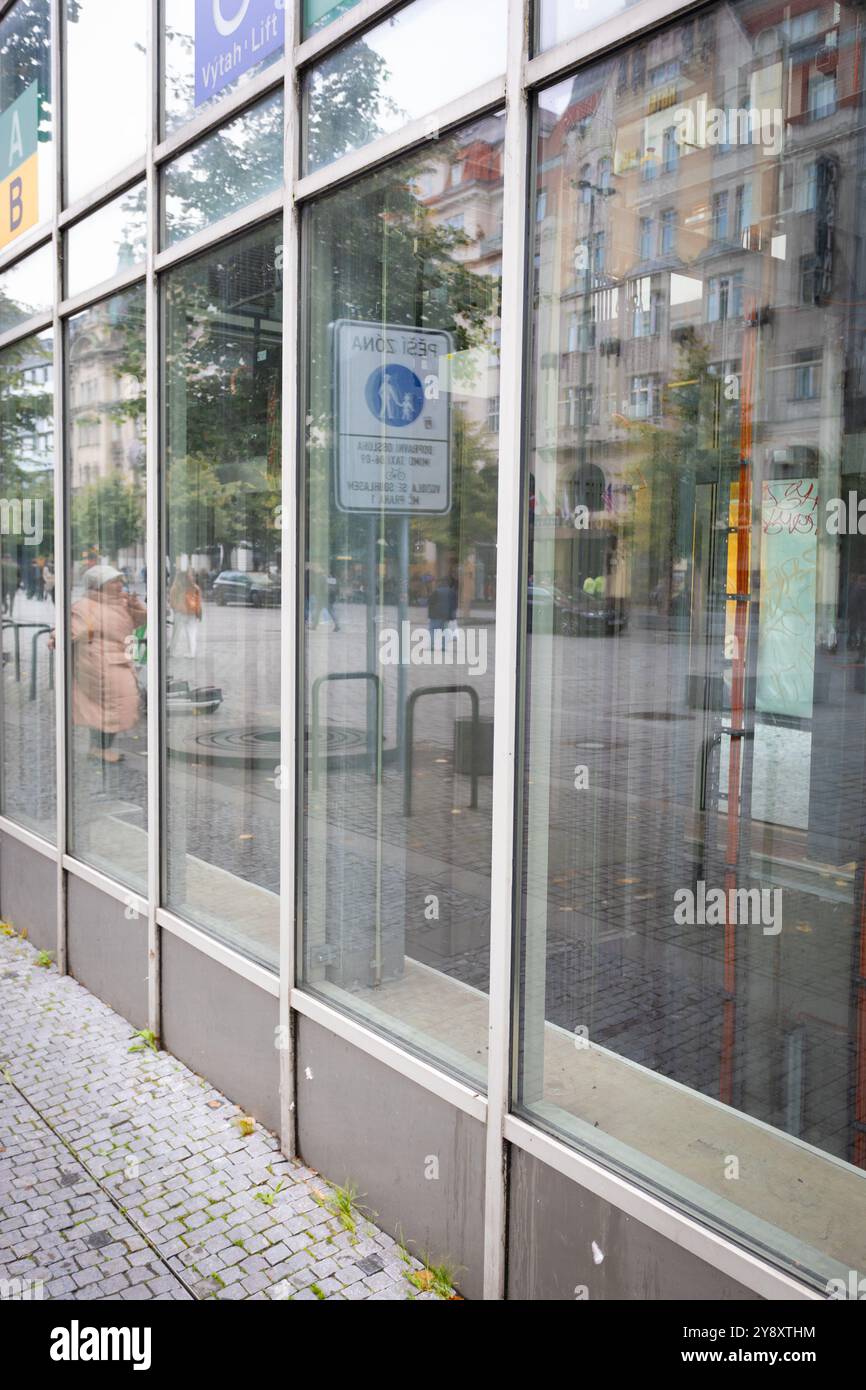 The architectural elements of the street are reflected in the windows ...