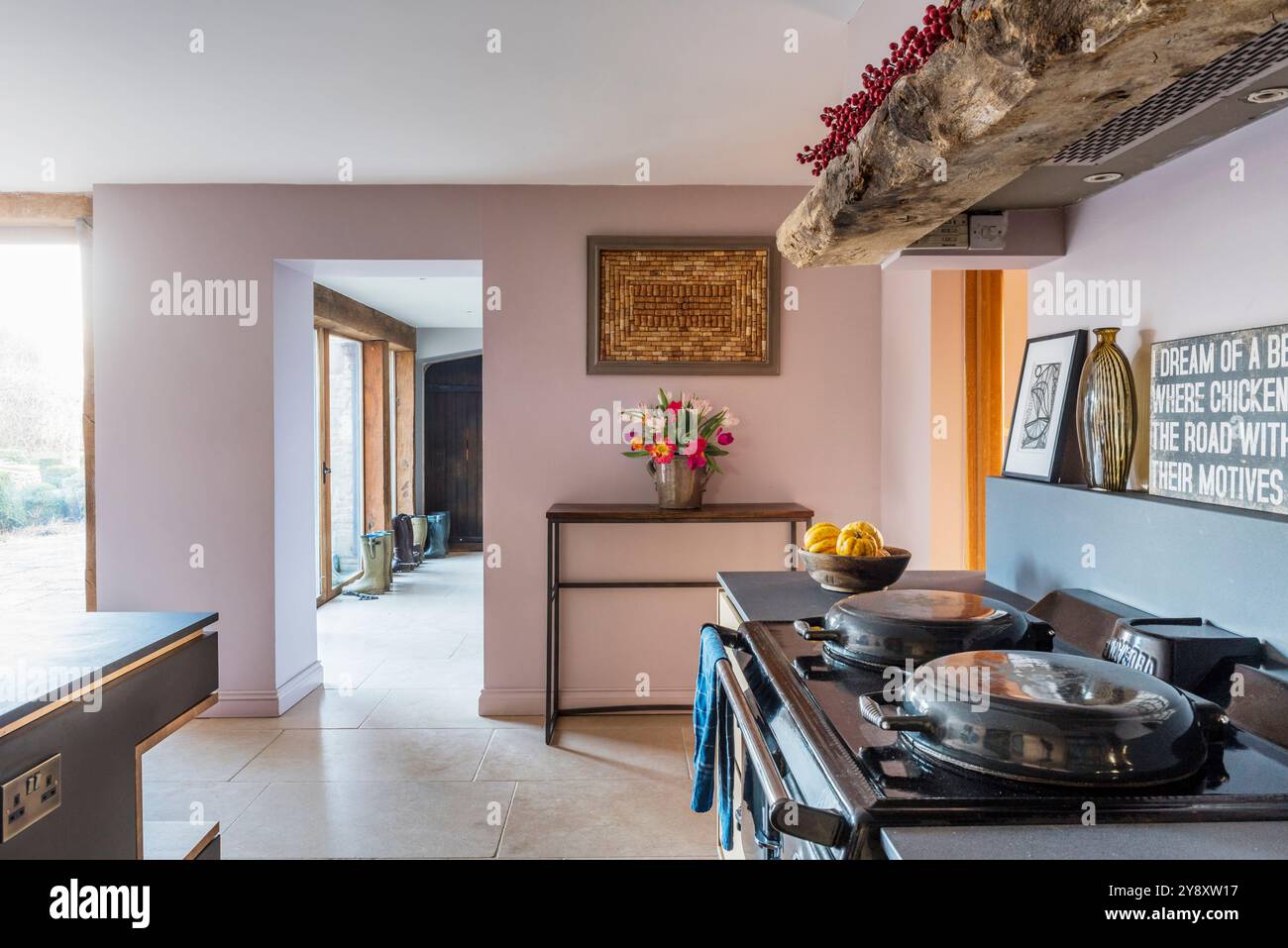 Shelf above hob with view through doorway from modern designer kitchen ...