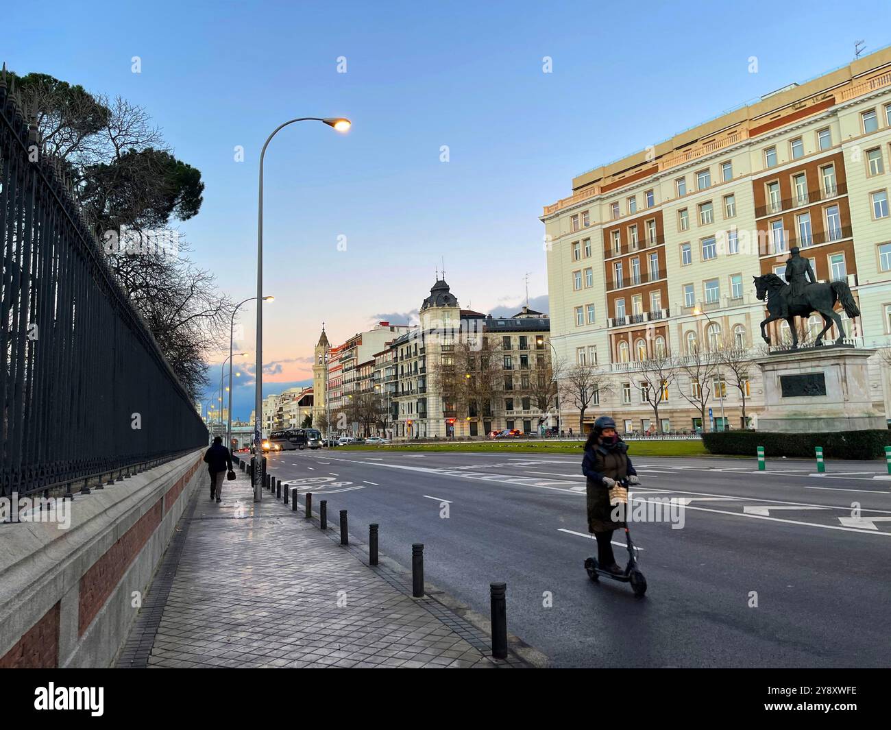 Woman riding a scooter along Alcala street. Madrid, Spain Stock Photo ...