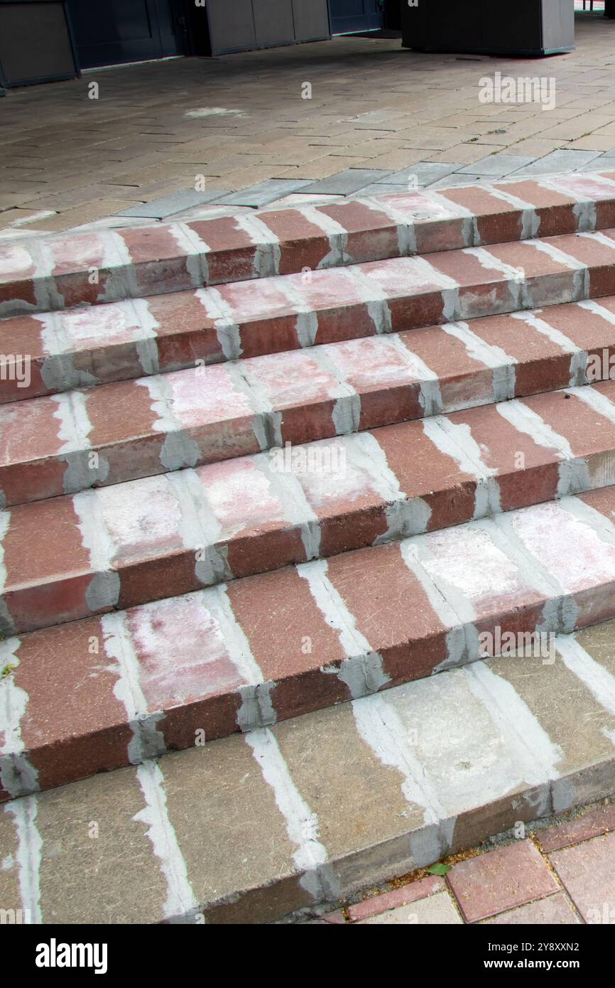 A staircase constructed from a combination of bricks and concrete ...