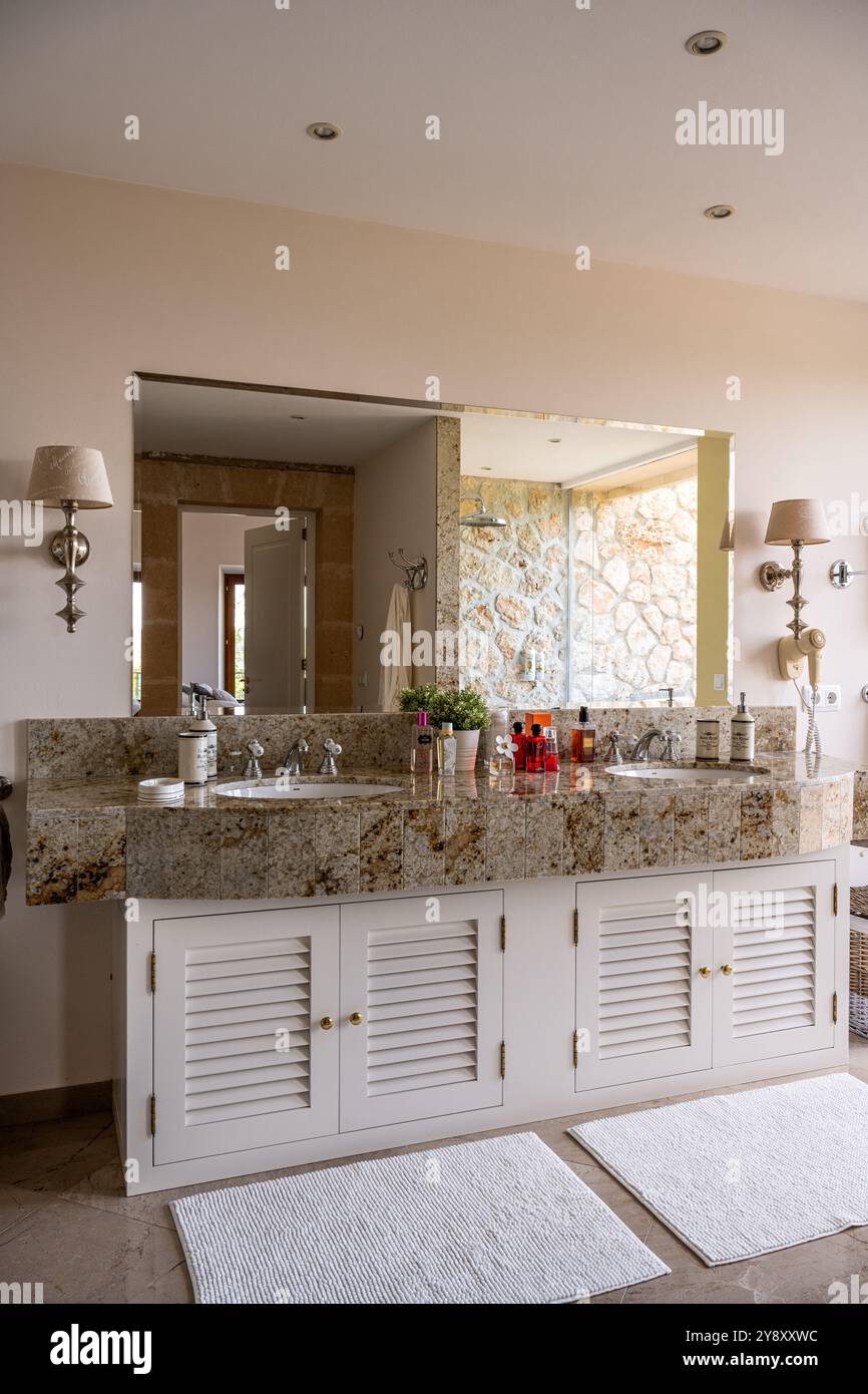 Under sink storage and mirror with double basins in Spanish villa ...