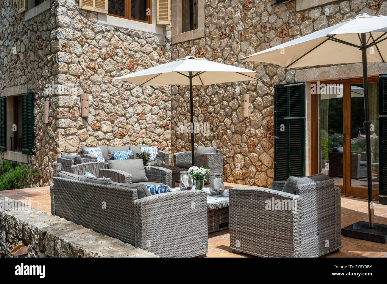 Parasols shading seating on terrace of Spanish villa, Mallorca Stock ...