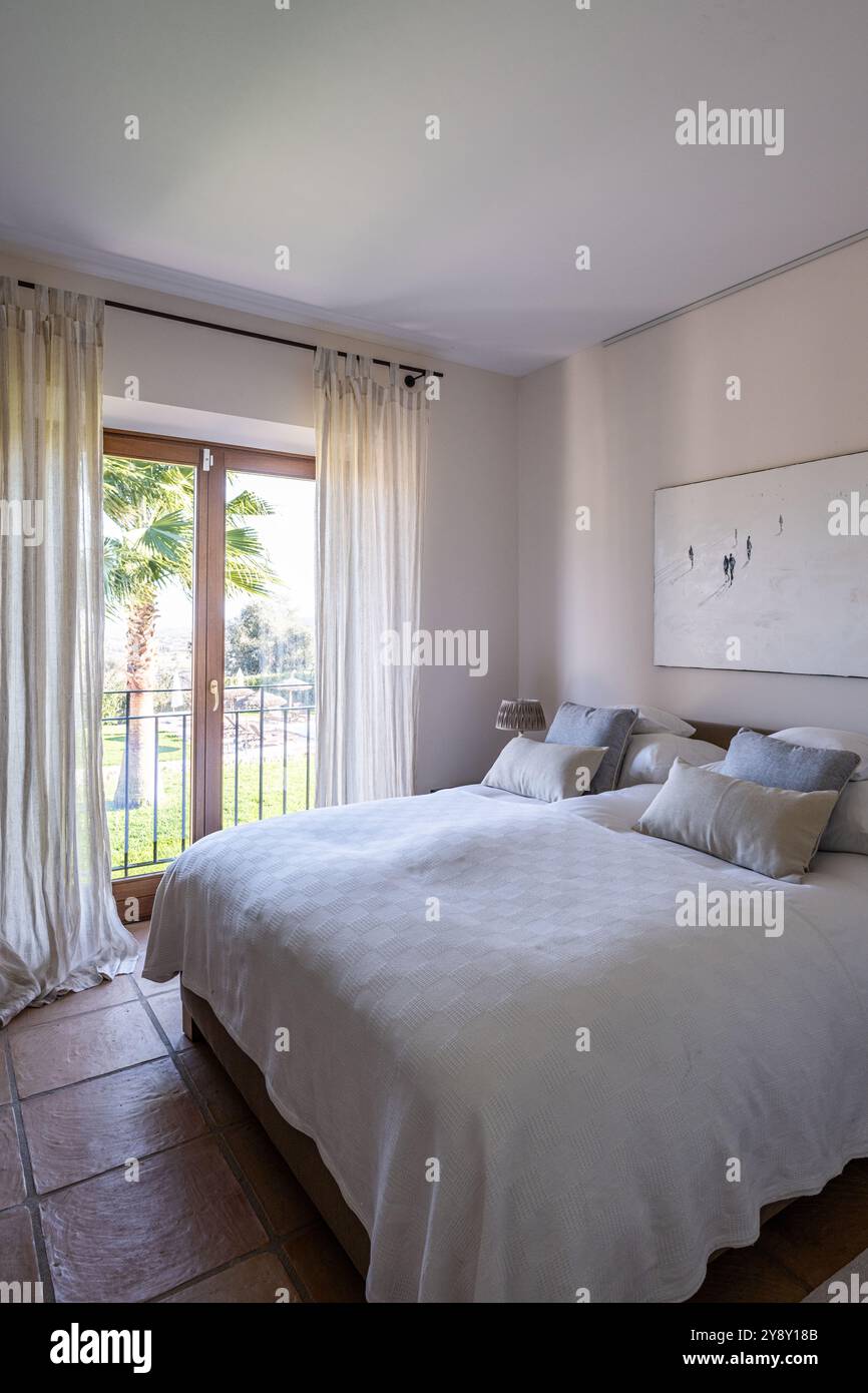 Double bed with French doors in Spanish villa, Mallorca Stock Photo - Alamy