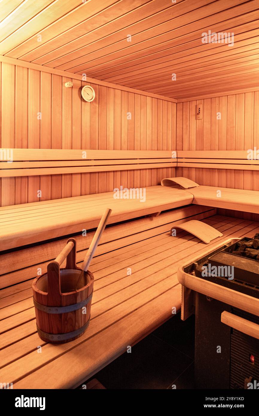 Wooden bench seating in sauna with bucket, Spanish villa, Mallorca ...