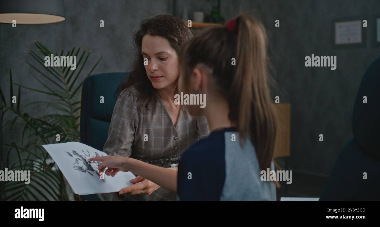 Female child psychologist shows illustrations hi-res stock photography ...