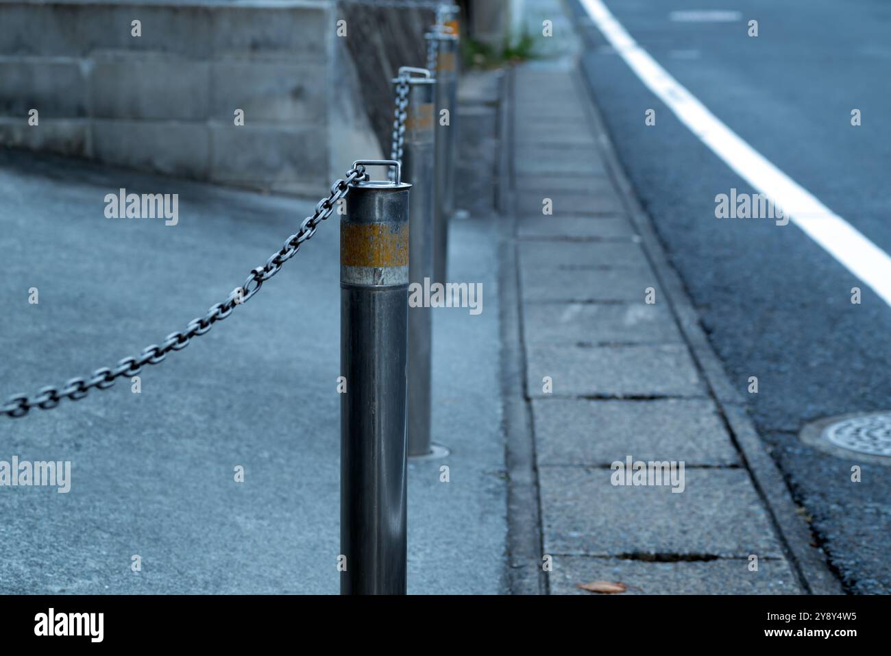 Stainless retractable parking bollard pole barrier with chains at the ...