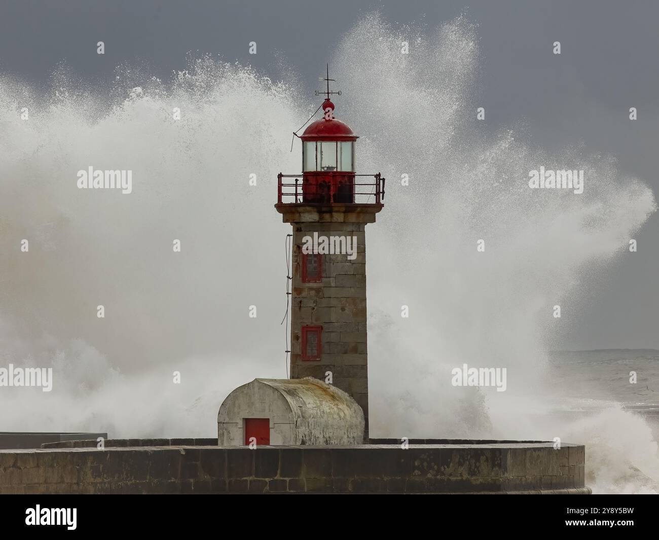 Big wave splash closeup. Douro river mouth old lighthouse and pier ...