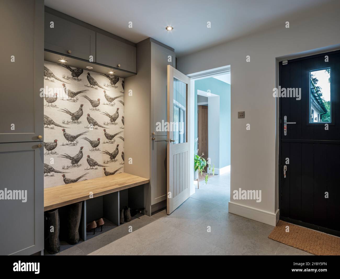 Luxury modern boot room and entrance hall with bench seat and shoe ...